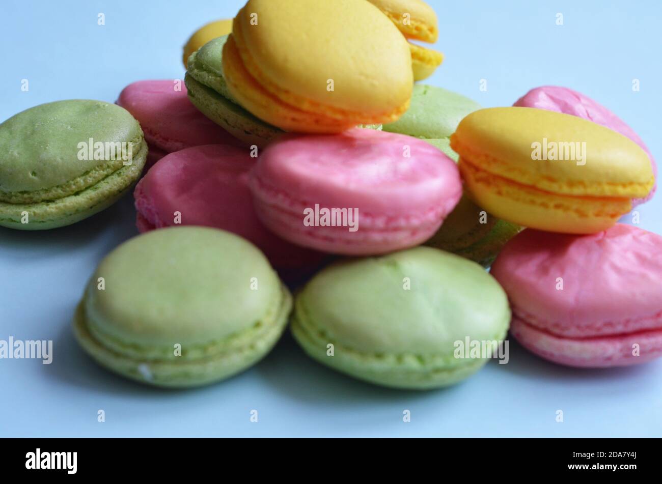 Mixed of colorful macaroni or pasta cake on a blue background. Sweet ...