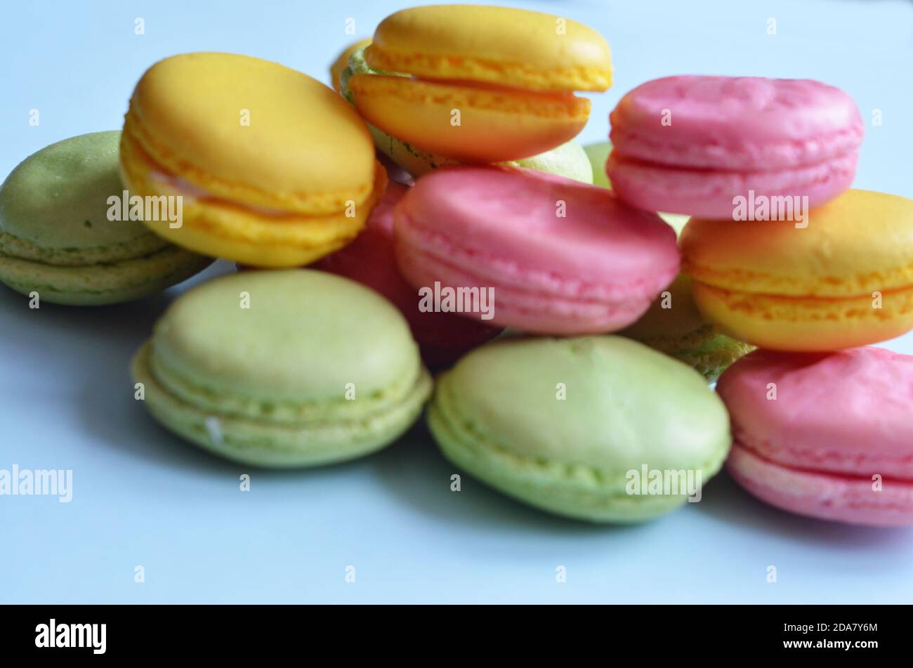 Mixed of colorful macaroni or pasta cake on a blue background. Sweet ...