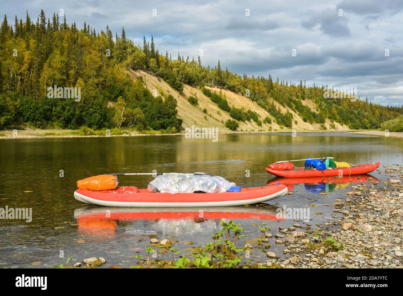 Inflatable kayak on the water. Tourist rafting on the northern river ...