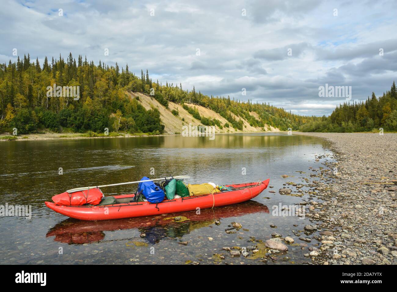 Inflatable kayak on the water. Tourist rafting on the northern river ...
