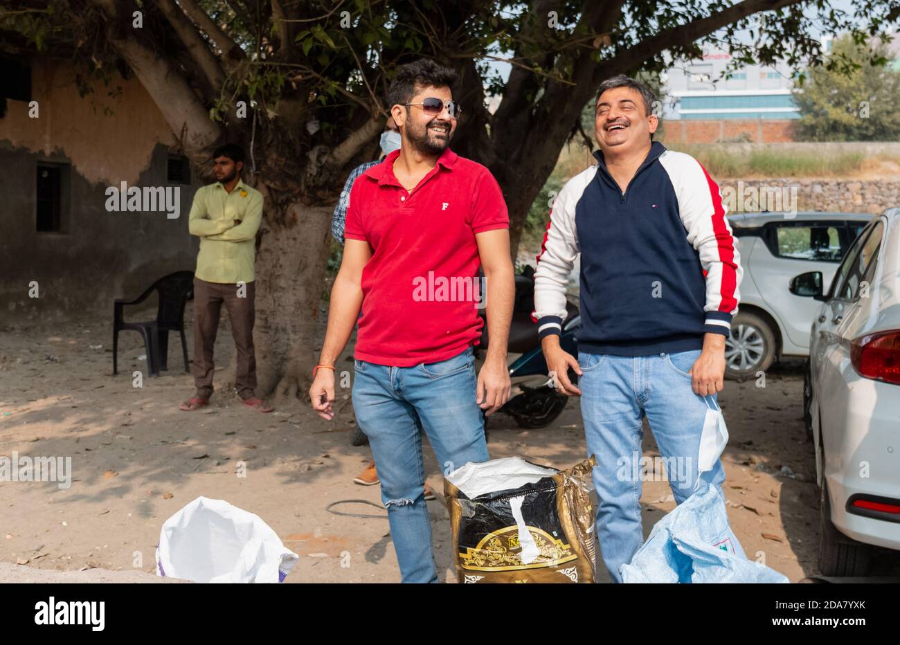 Group of young people of NGO in India distributing food to poor ...