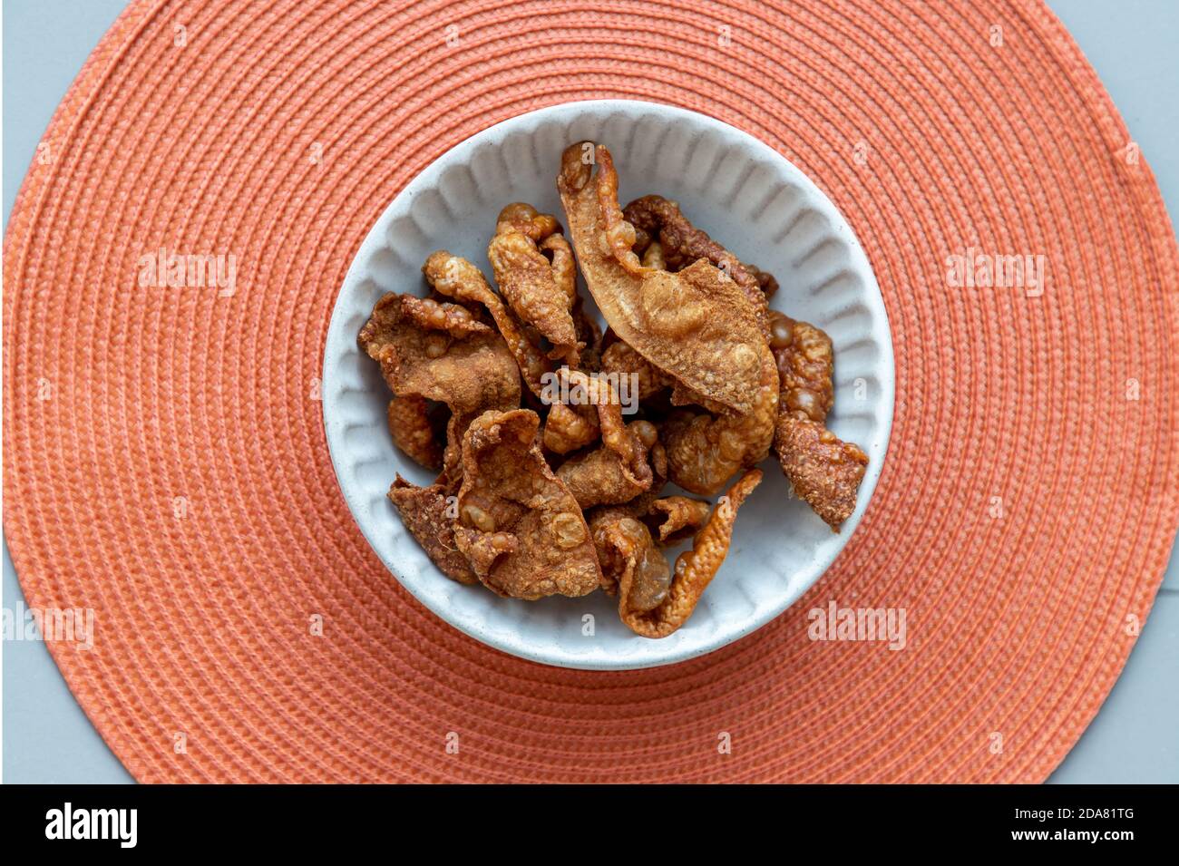 Thai Traditional Snacks, Crispy Fried Chicken skins in a white bowl on ...