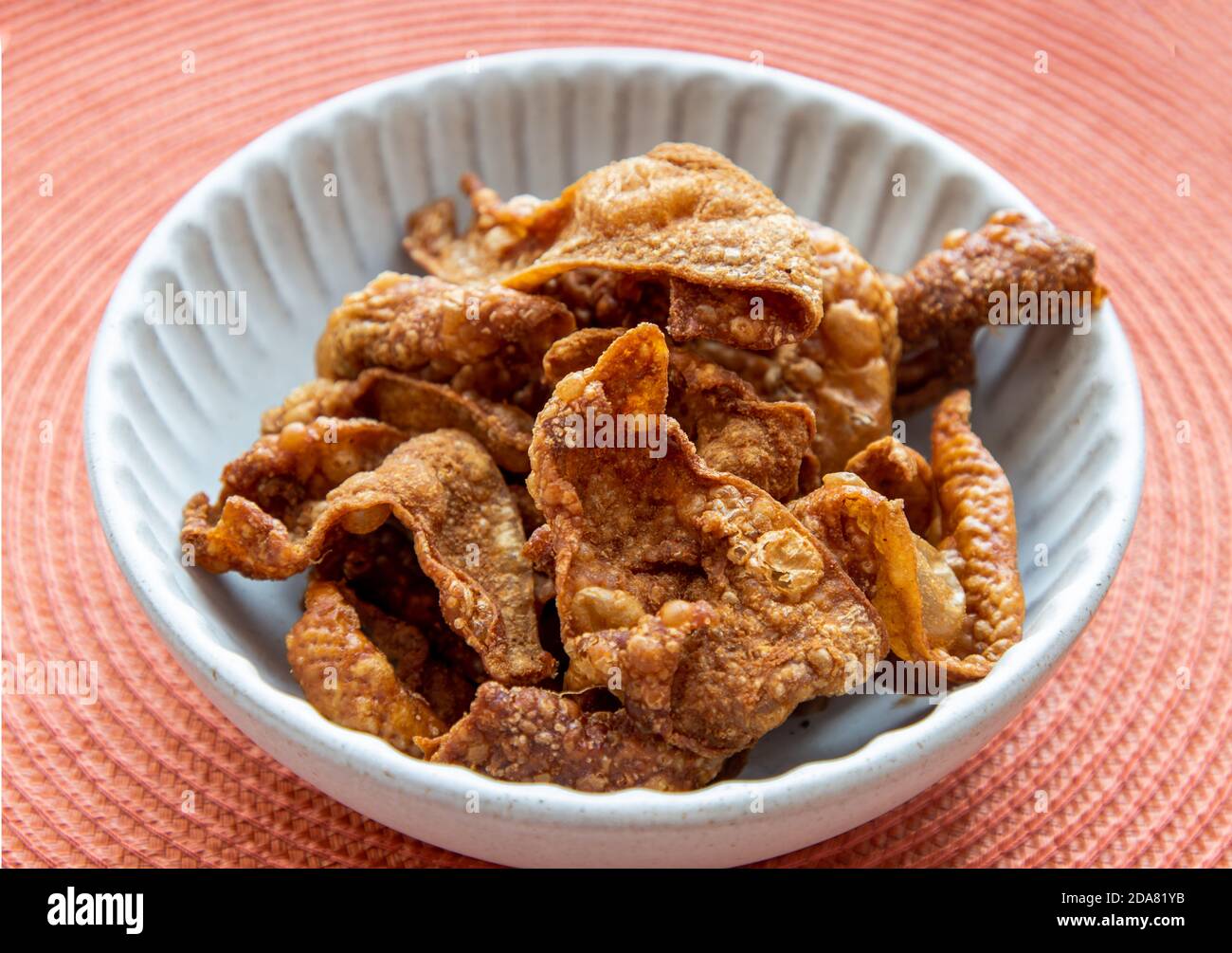 Thai Traditional Snacks, Crispy Fried Chicken skins in a white bowl on ...