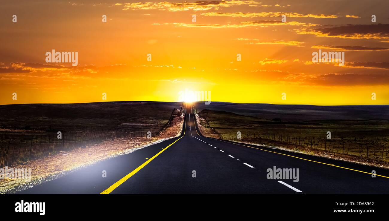 Endless Highway in Evening Landscape Stock Photo - Alamy