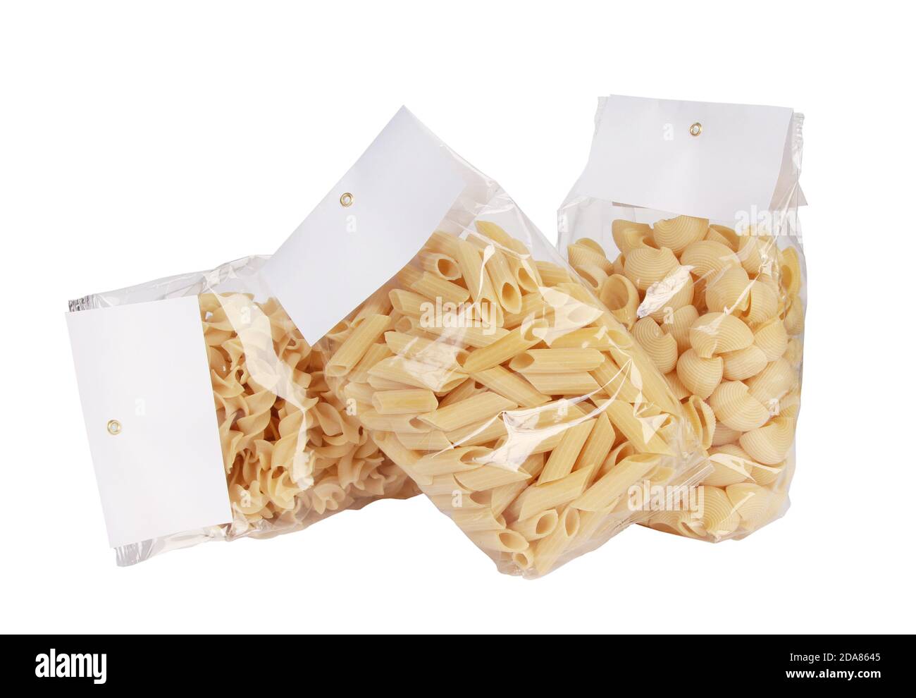 Three clear packages of various pasta isolated on a white background ...