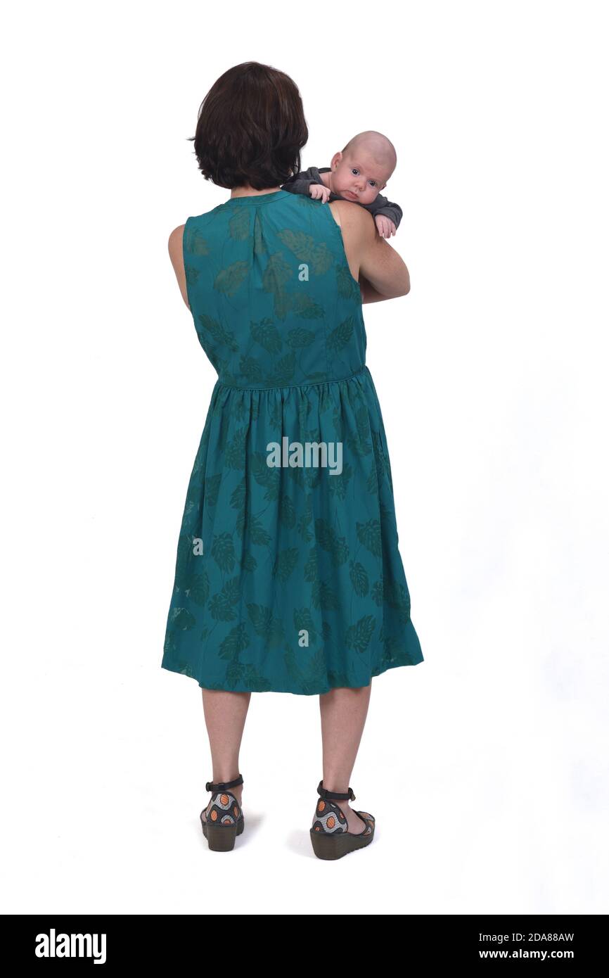 rear view of full portrait of a mother with her baby on white ...