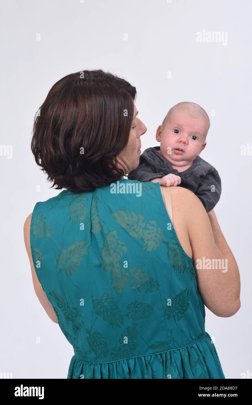 rear view of a mother with her baby on white background Stock Photo - Alamy