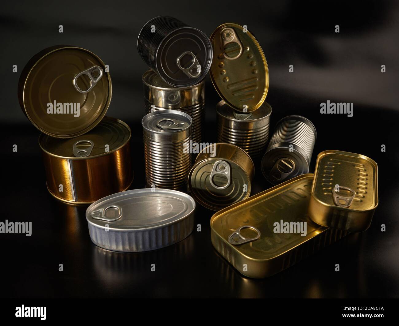 Different types of cans with prepared foods for consumption, vegetables ...