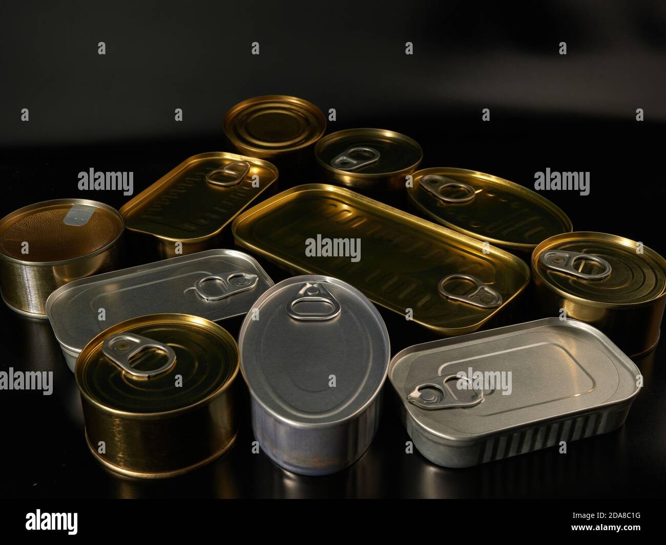 Different types of cans with prepared foods for consumption, vegetables ...
