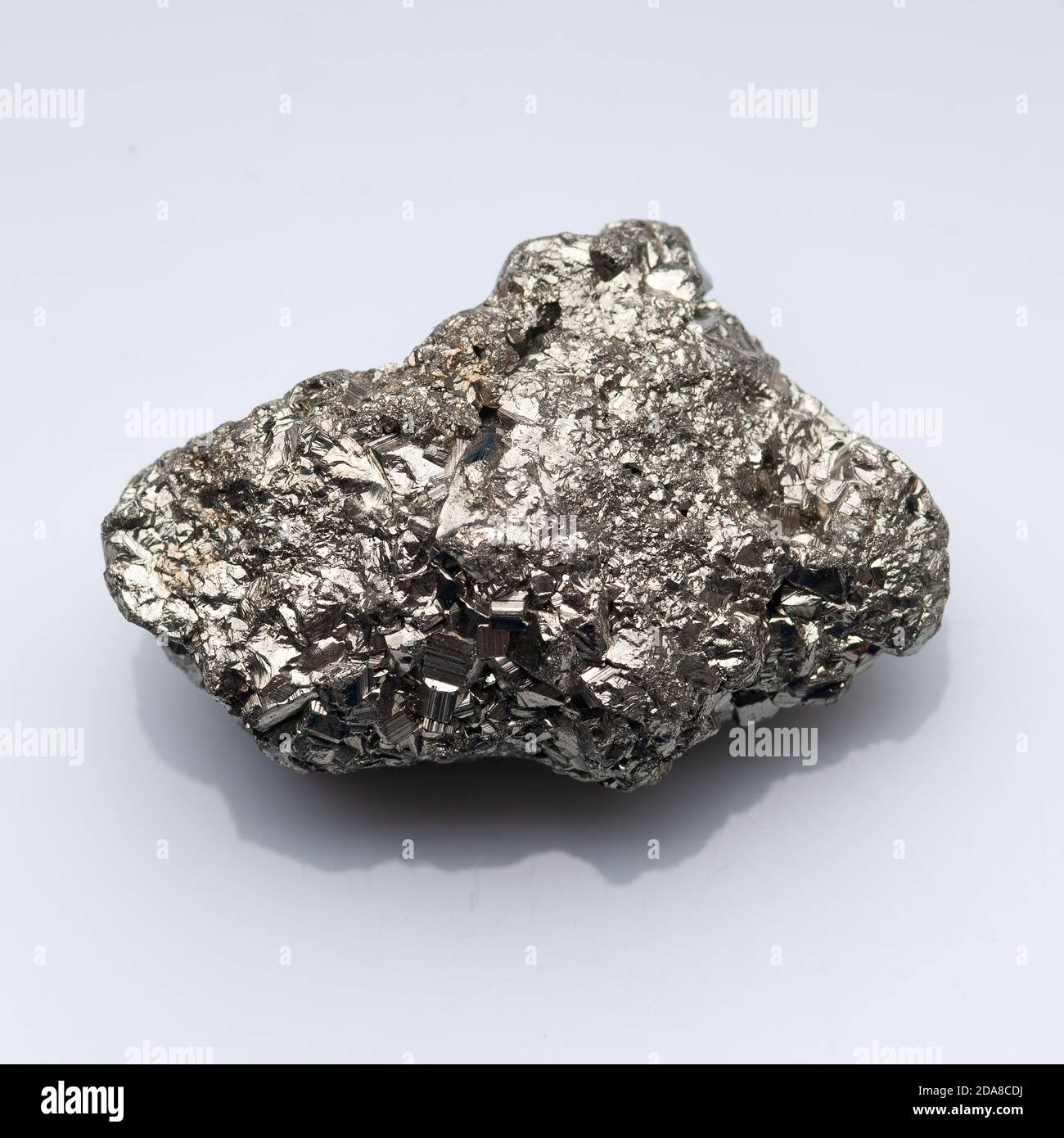 Natural mineral pyrite on white background Stock Photo - Alamy