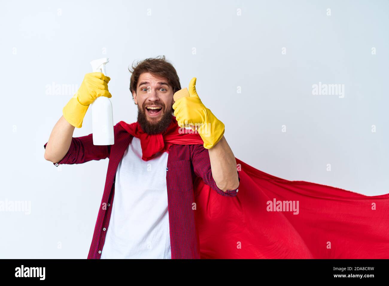 cleaner wearing a red coat detergent service housework Stock Photo - Alamy
