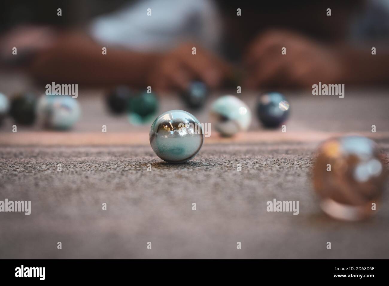 I shot this of a friend playing marbles in my neighborhood. If you look ...