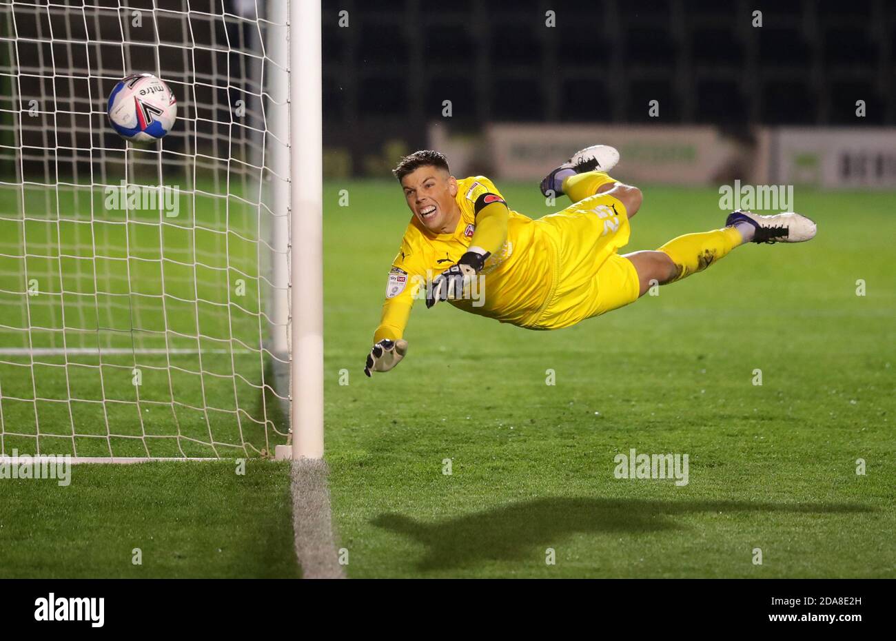 Swindon Town goalkeeper Joe Fryer makes a save during the Papa John's ...