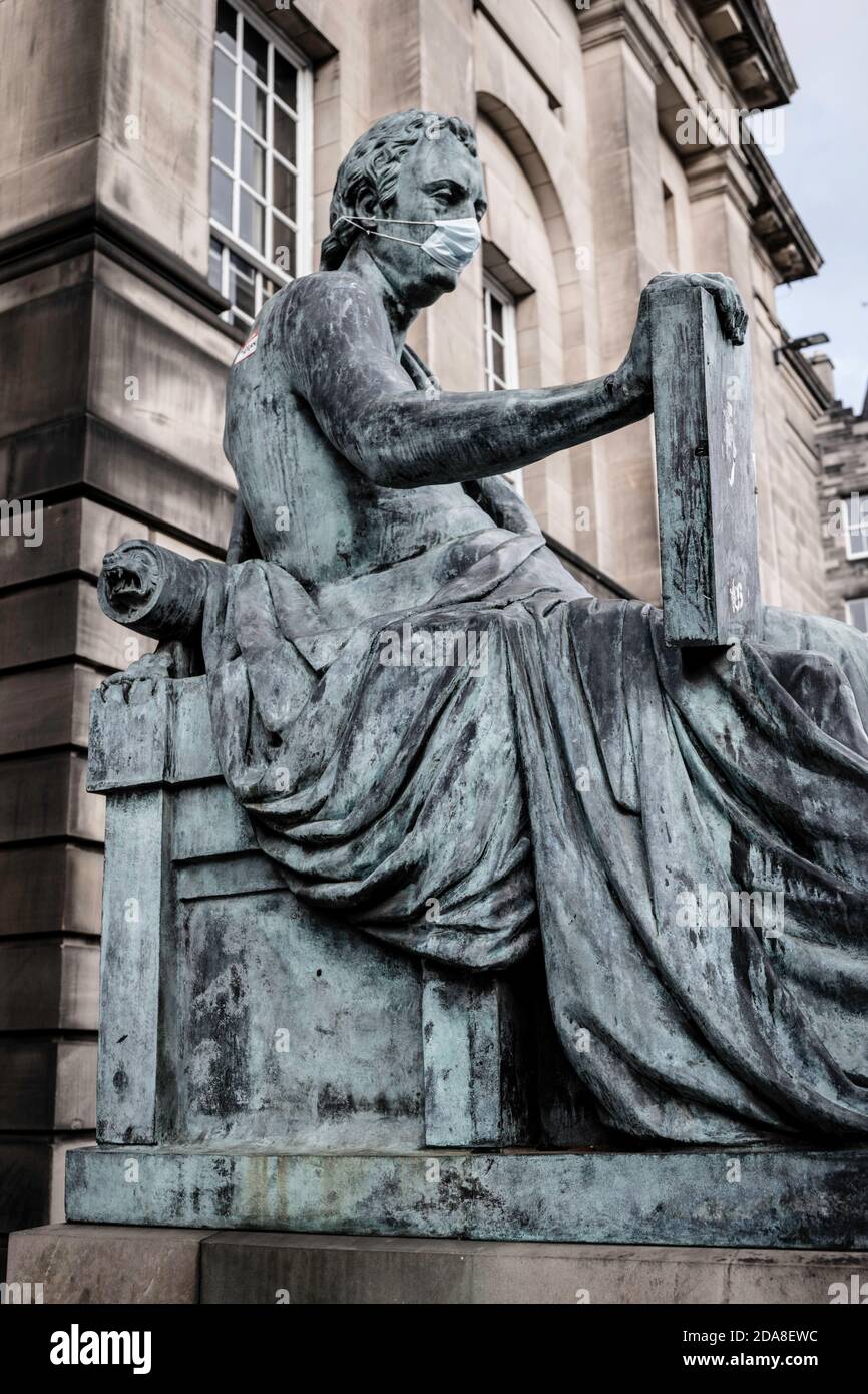 Statue wearing mask Edinburgh, Statue of David Hume Edinburgh with a ...