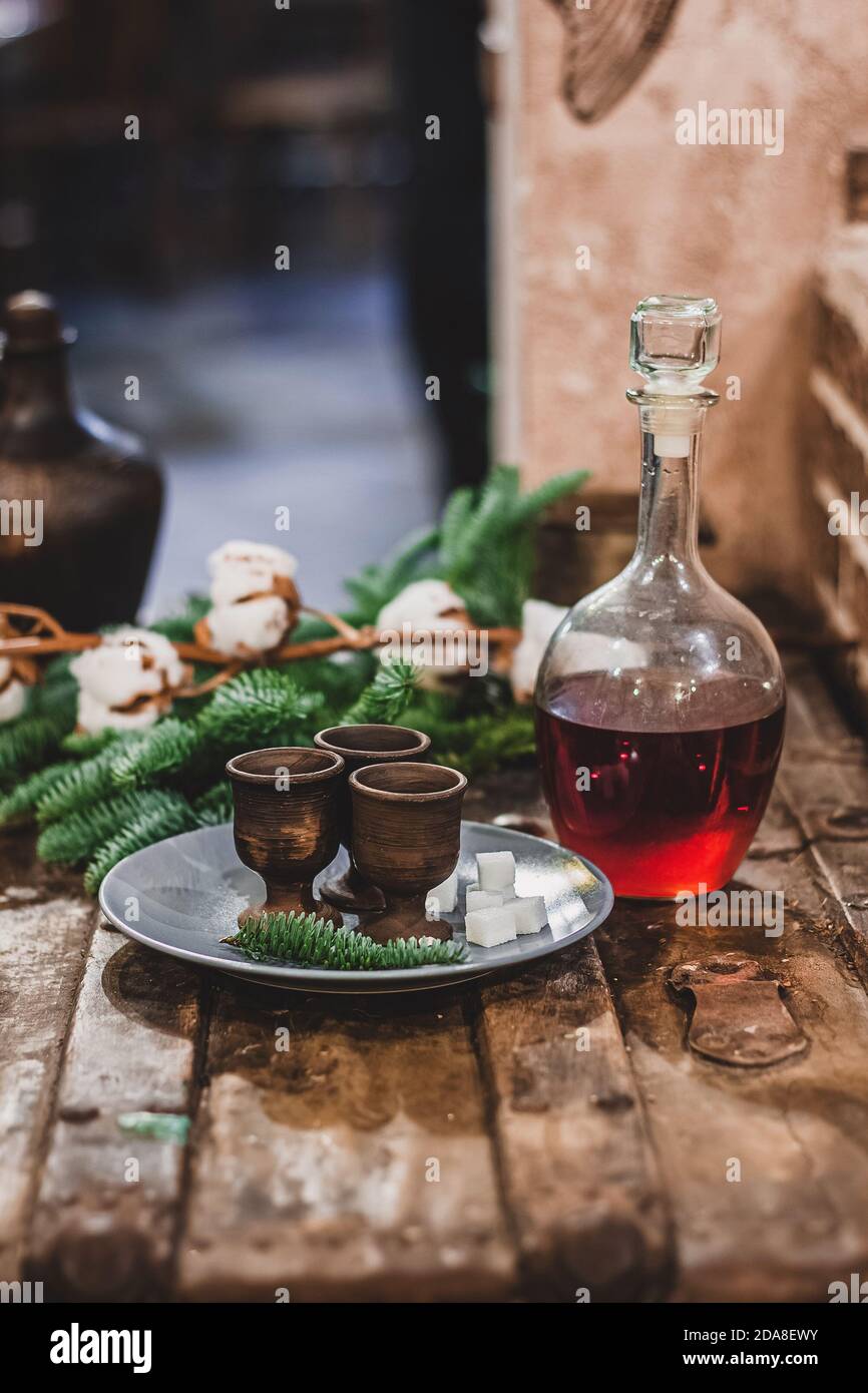 Christmas vintage background, craft alcohol drink and ancient dishes ...