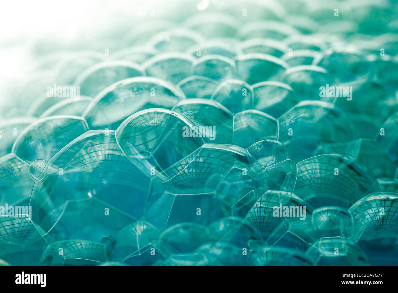 Pile of dark green soap bubbles with a gradient from white to green ...