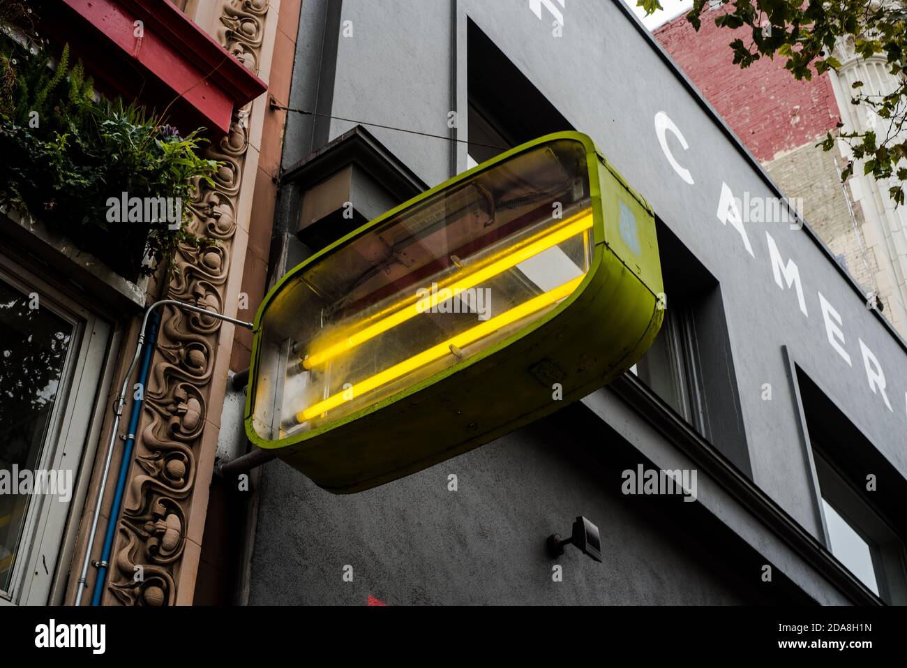 Yellow lights on store's sign Stock Photo - Alamy
