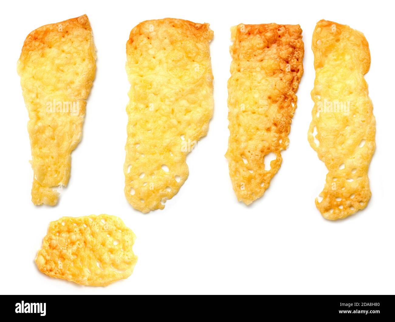 Different shapes of baked cheese on white uniform background, golden ...