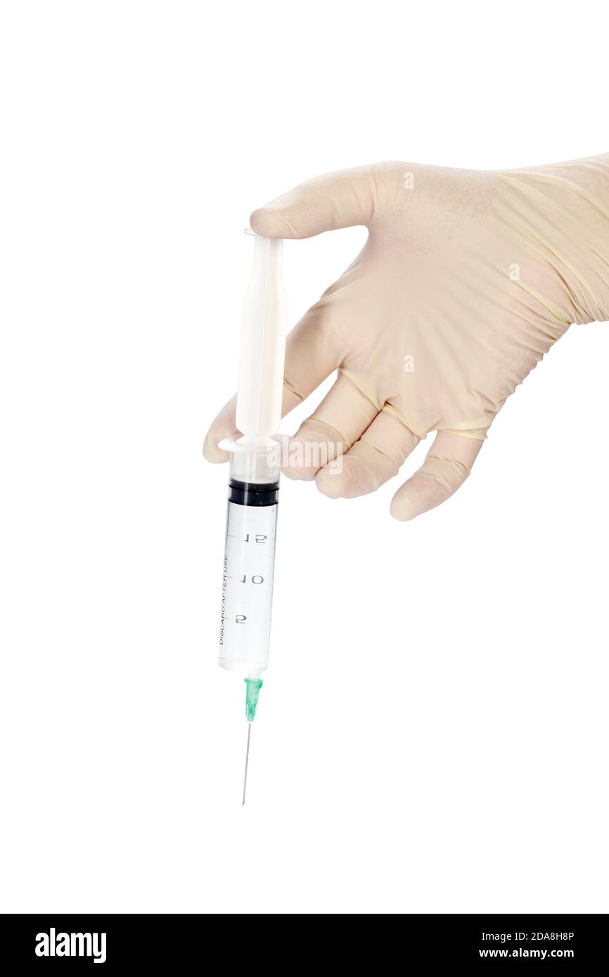 Doctor's hand holding syringe isolated on a white background Stock ...