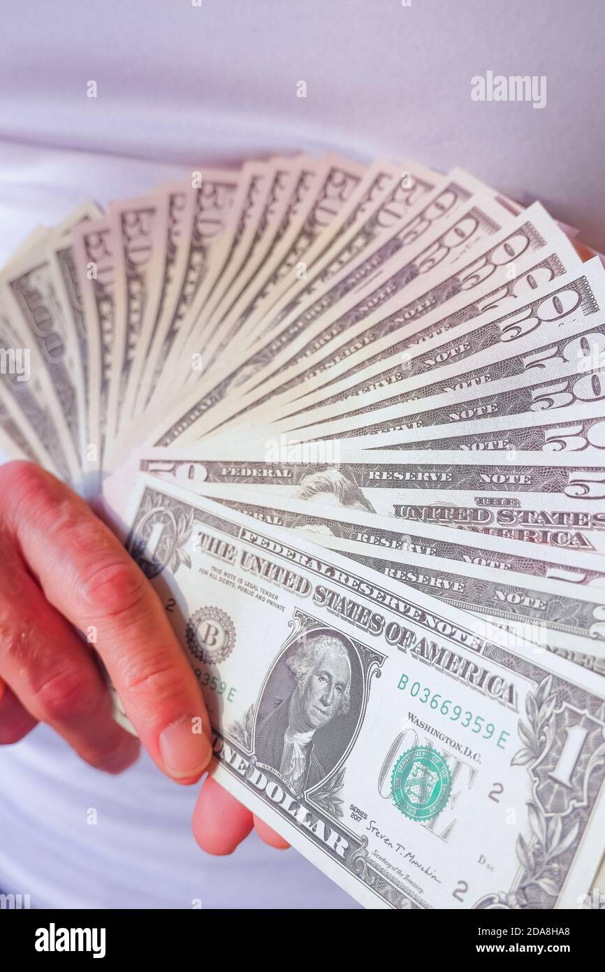 Hand holds american Dollar-bills.Adult man hands count money Stock ...