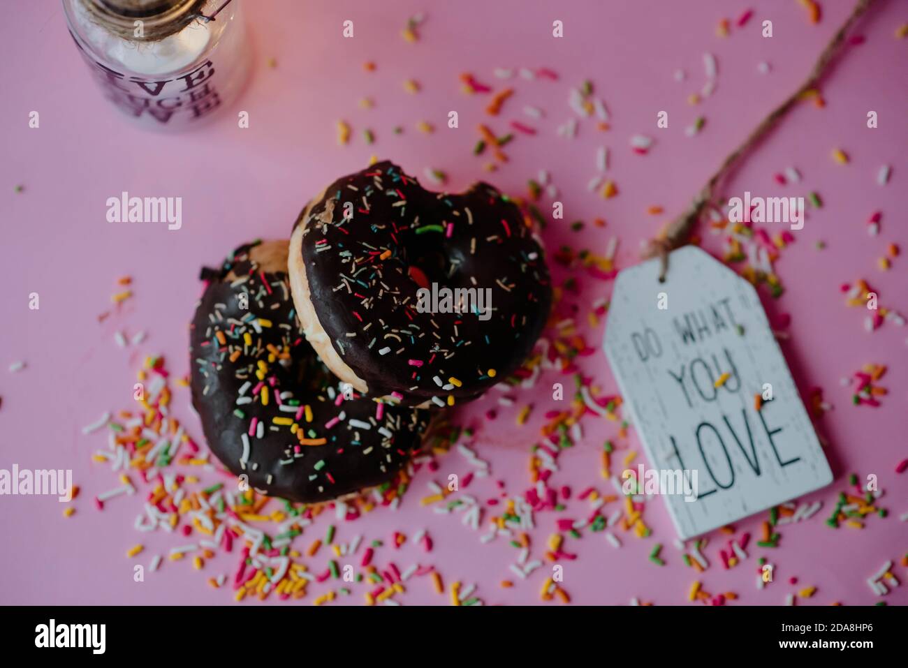 Closeup shot of delicious chocolate donuts with sprinkles and love ...