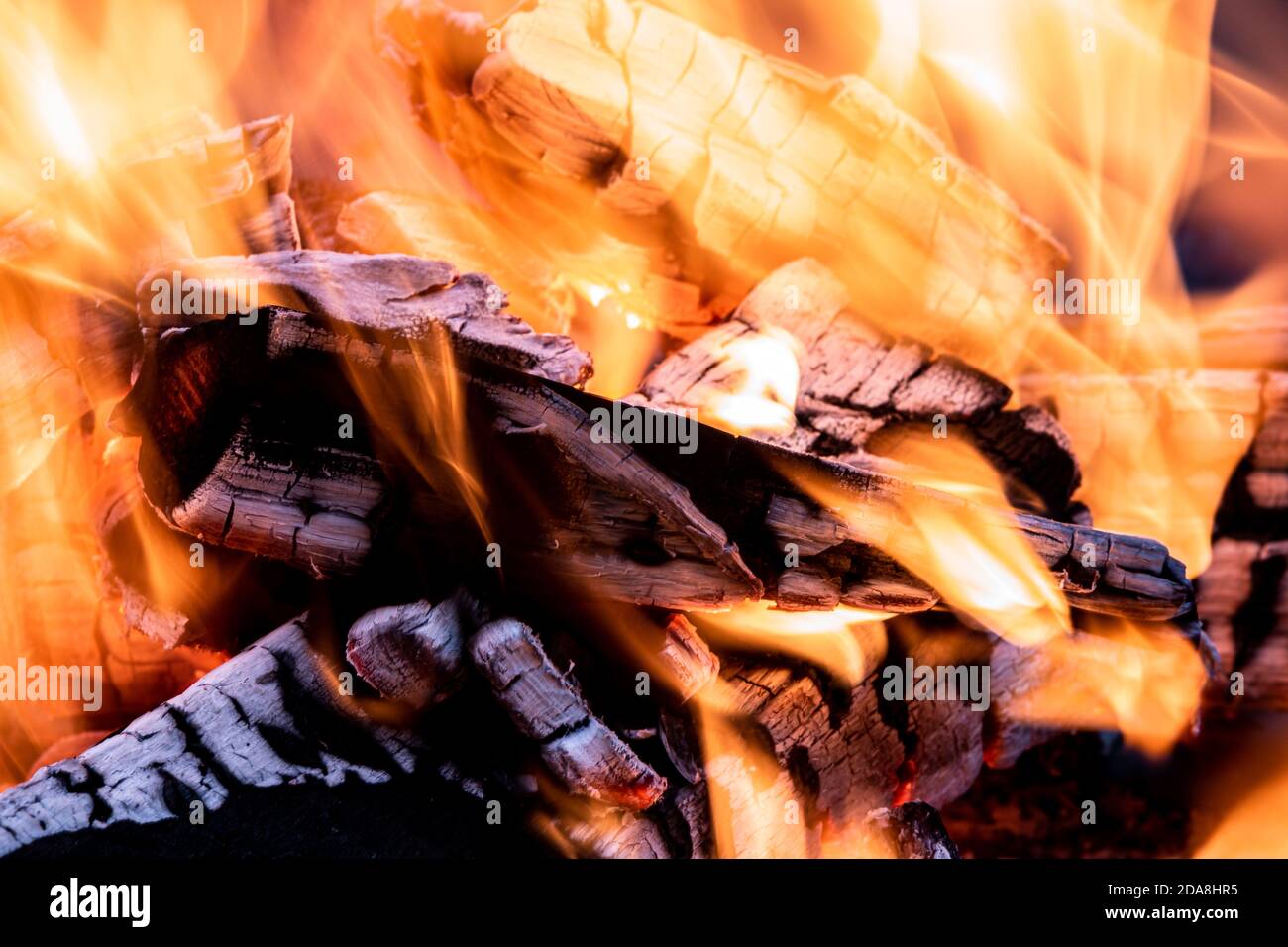 Burning fire in a small fire bowl, closeup sho of flames and burning ...
