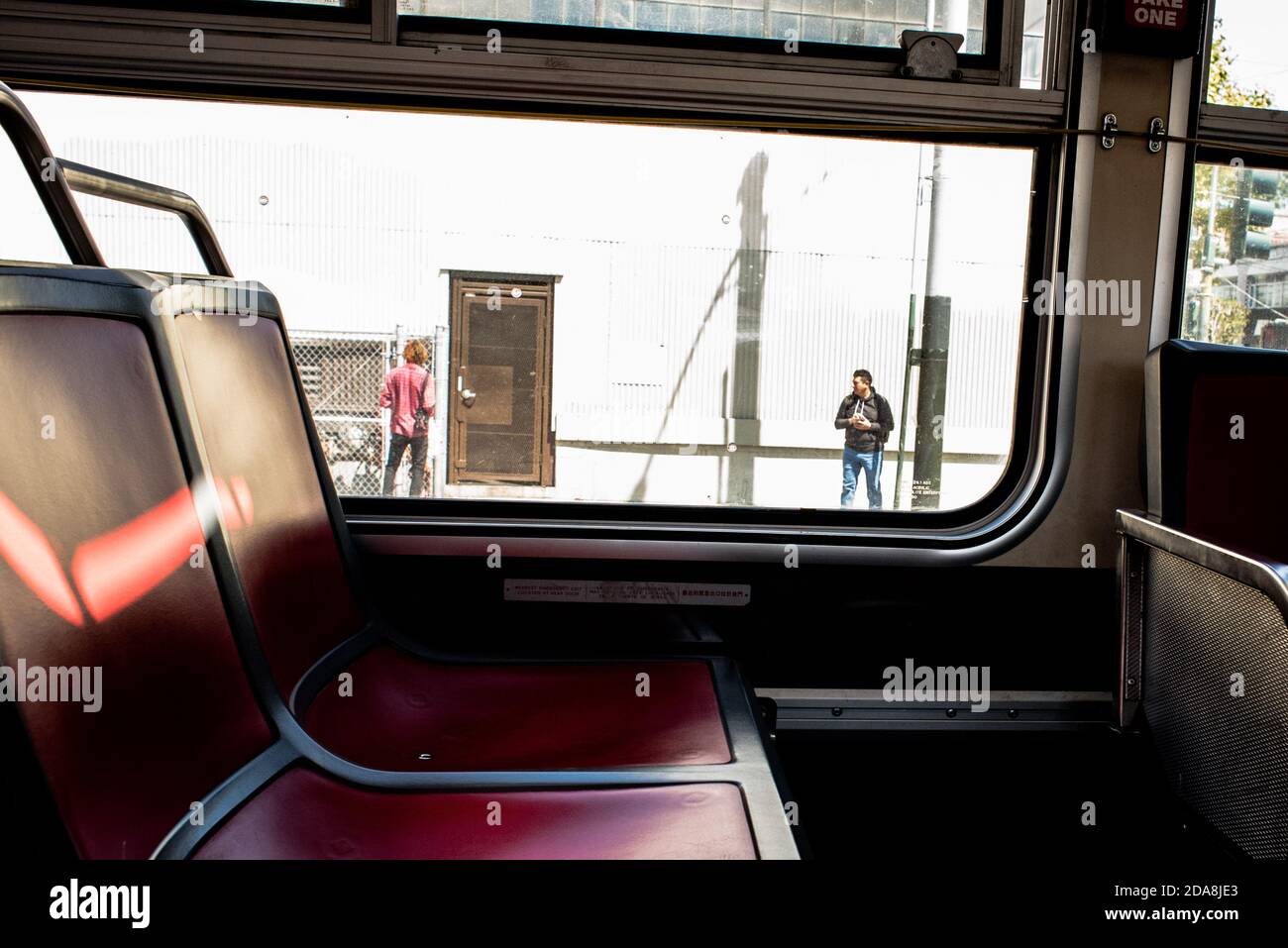 Guys talking outside the bus Stock Photo - Alamy