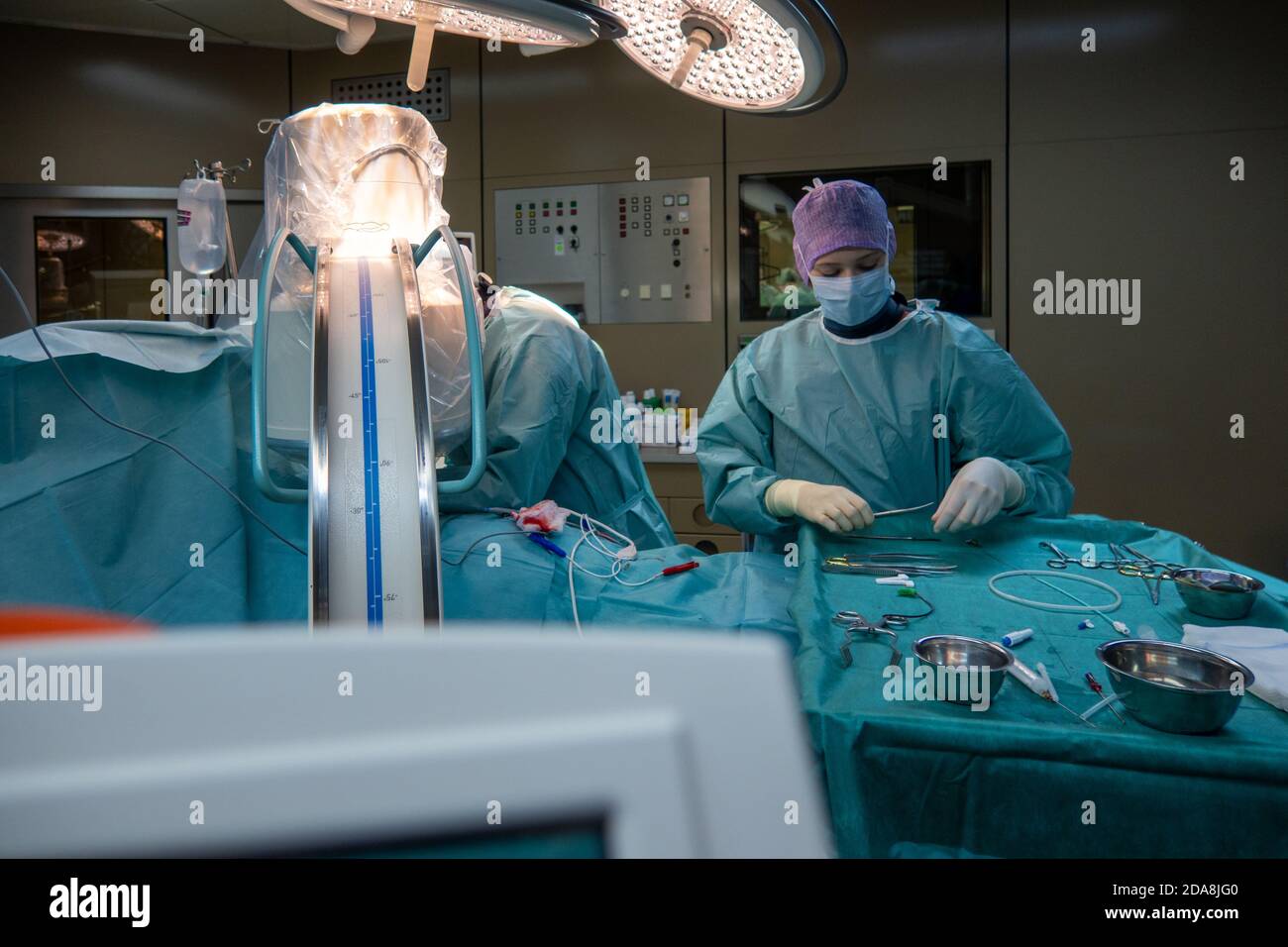 a surgeon performs a defibrillator implantation in a hospital Stock ...