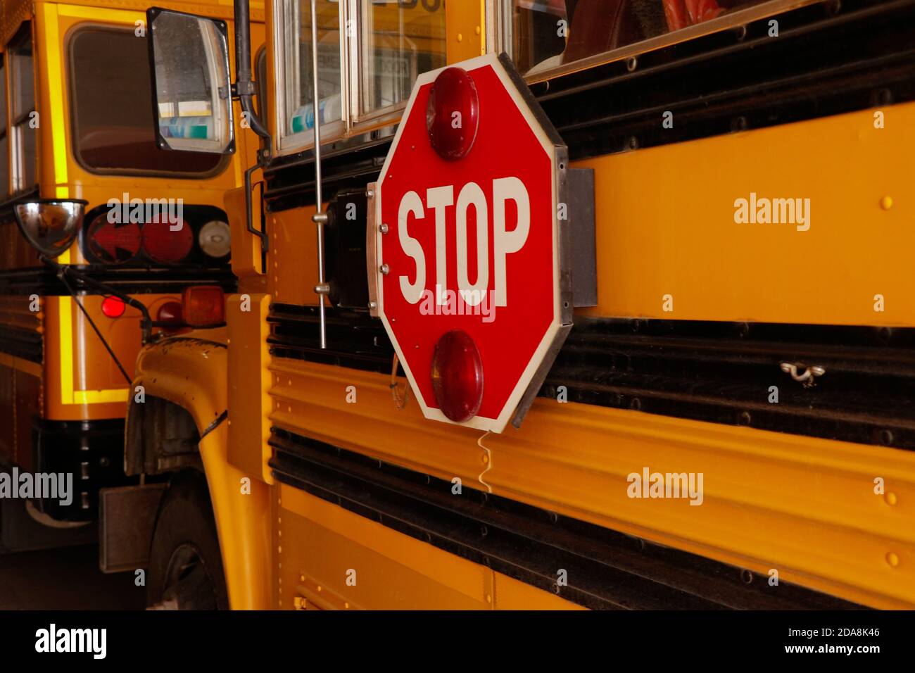 School bus sitting in the garage Stock Photo - Alamy