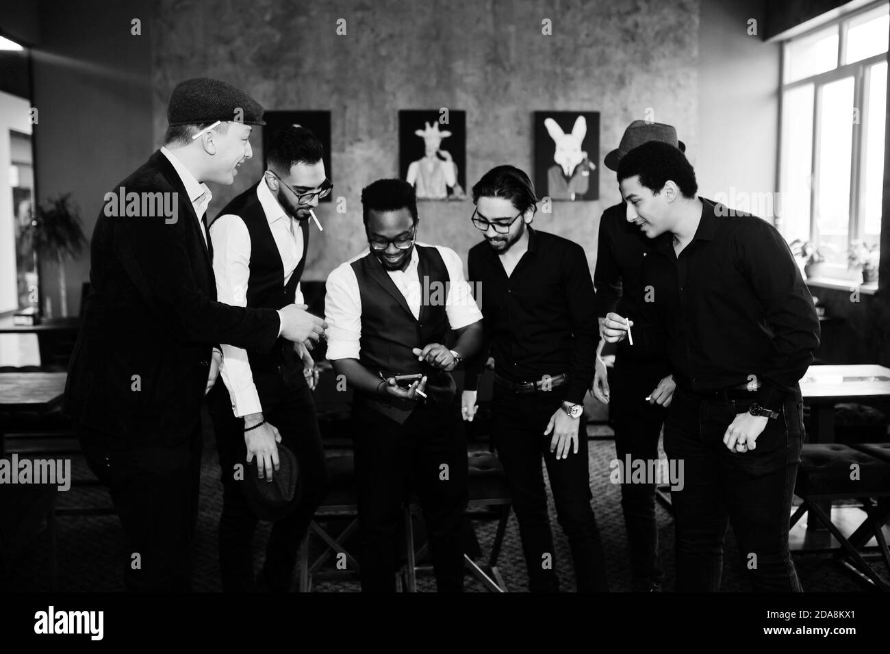 Group of handsome retro well-dressed man gangsters spend time at club ...