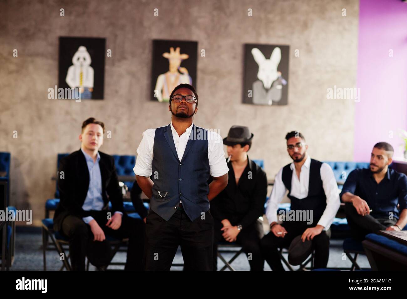 Stylish african american man against group of handsome retro well ...