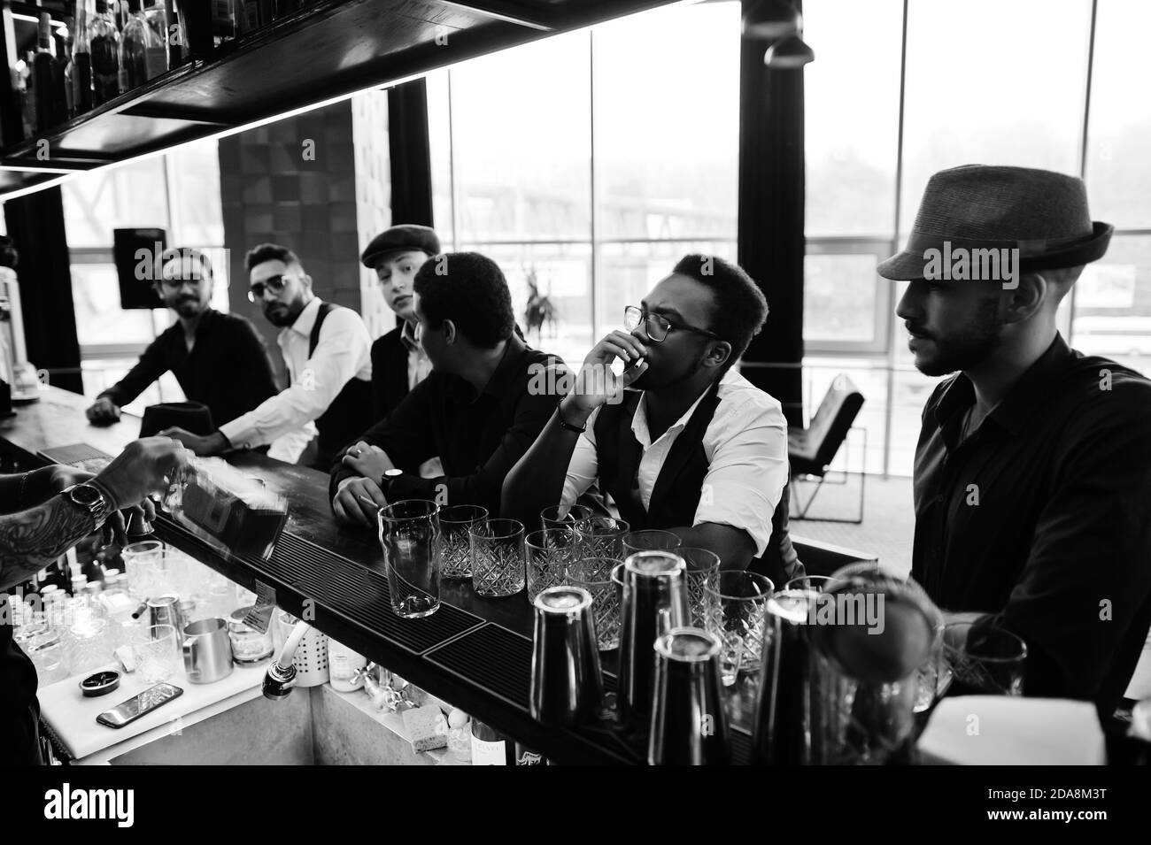 Group of handsome retro well-dressed man gangsters spend time at club ...