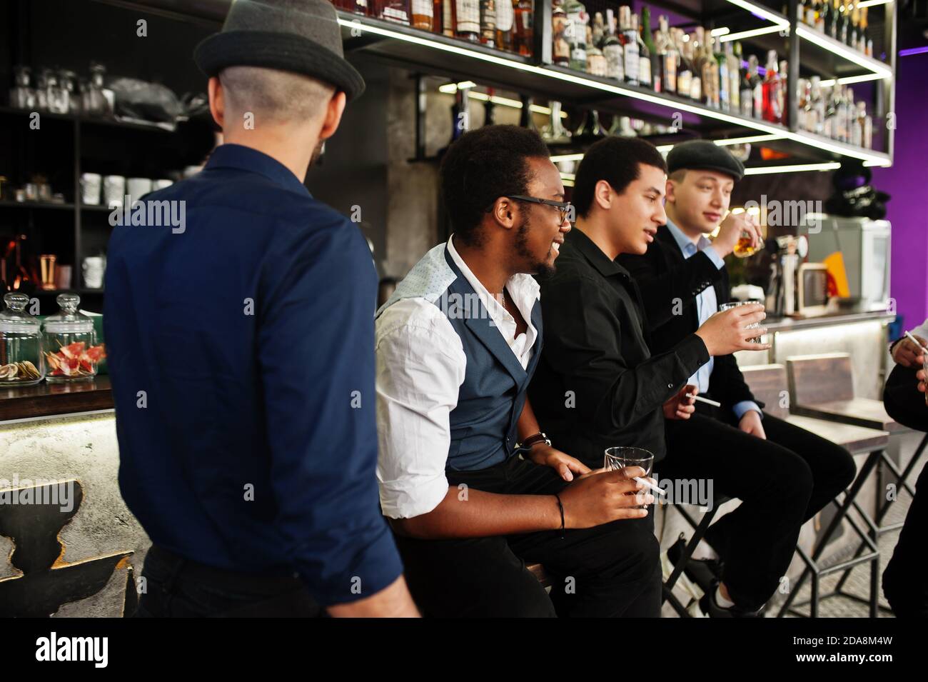 Group of handsome retro well-dressed man gangsters spend time at club ...
