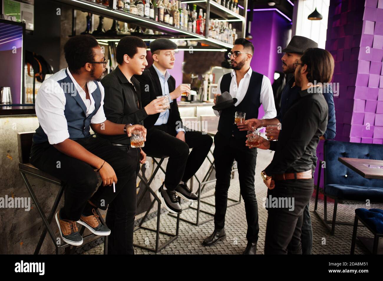 Group of handsome retro well-dressed man gangsters spend time at club ...