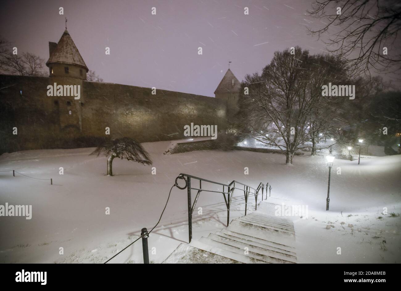 Heavy snowfall winter night at historic Old Town of Tallinn, Estonia ...
