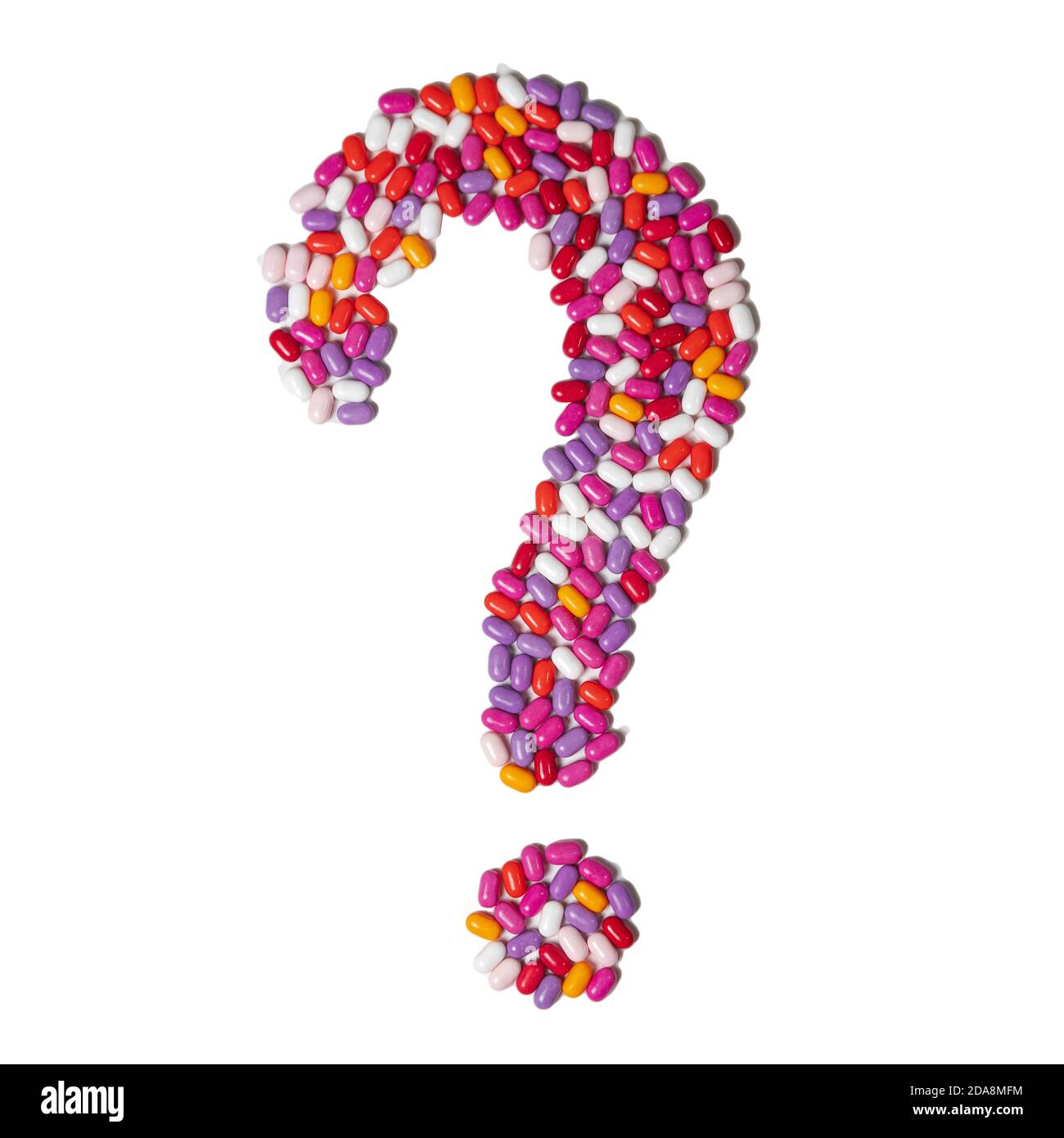 question mark of colored pills on a white background. colored pills ...