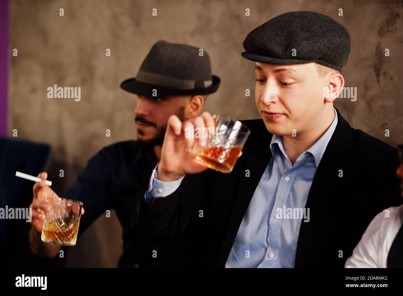 Group of handsome retro well-dressed man gangsters spend time at club ...