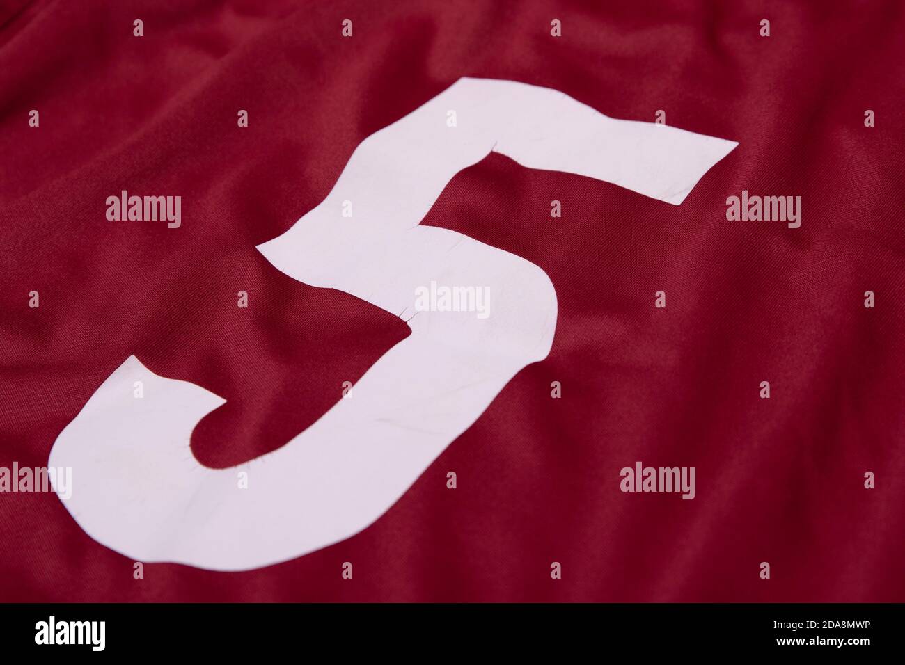 Large White Number Five on the back of a burgundy football shirt Stock ...