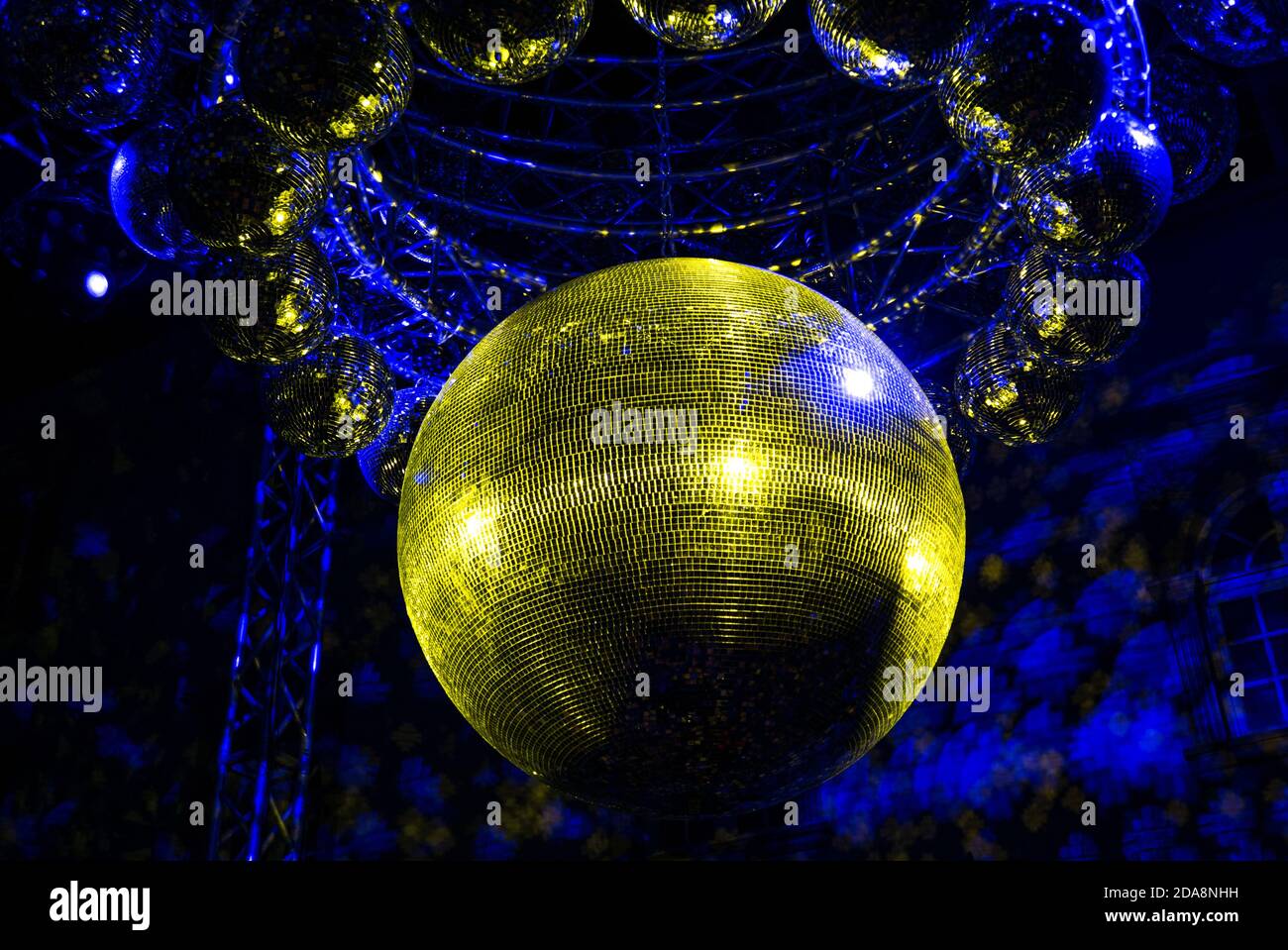 Low angle shot of a sparkling yellow disco ball Stock Photo - Alamy