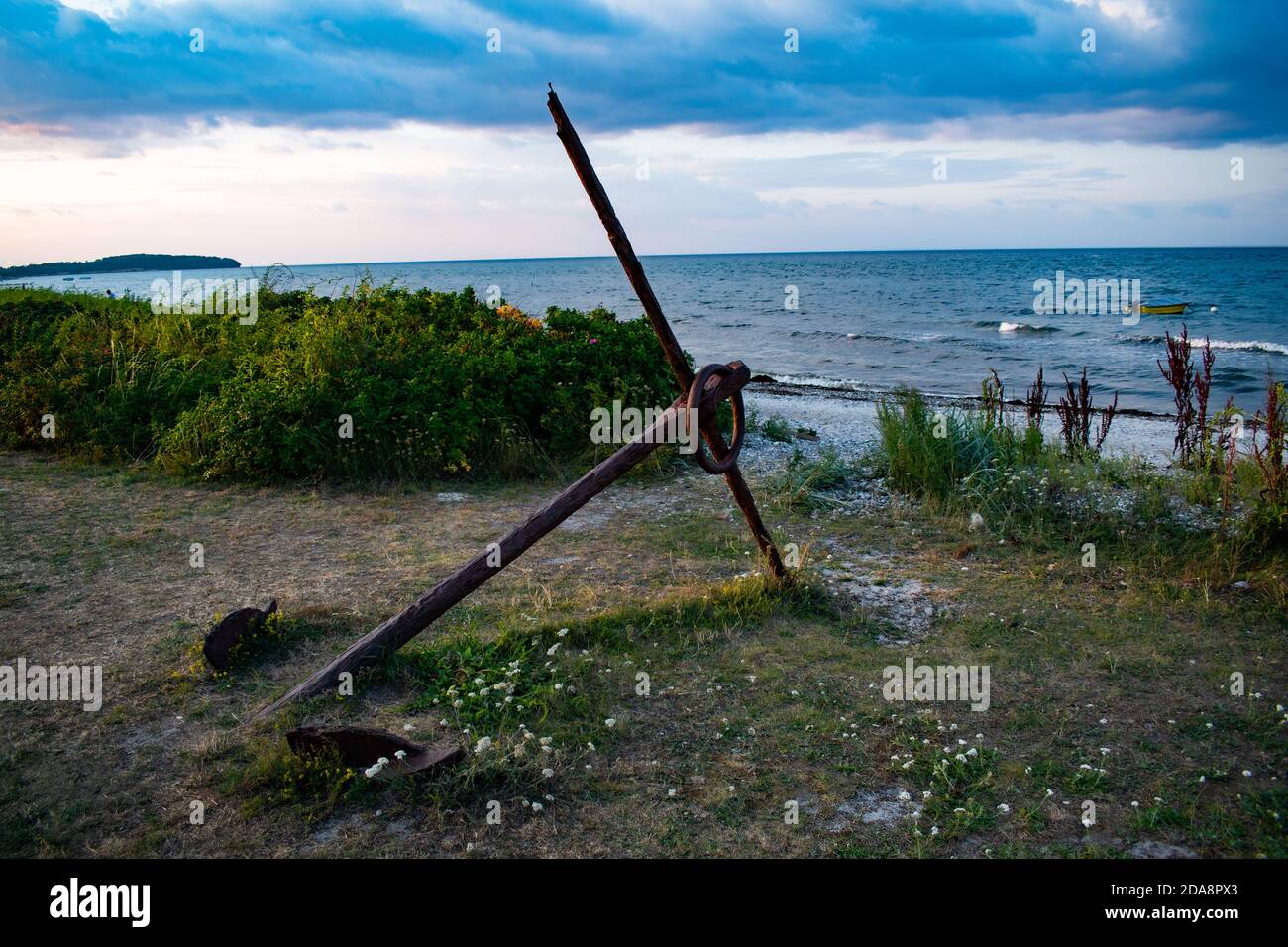 Huge rustic ship anchor on the shore Stock Photo - Alamy