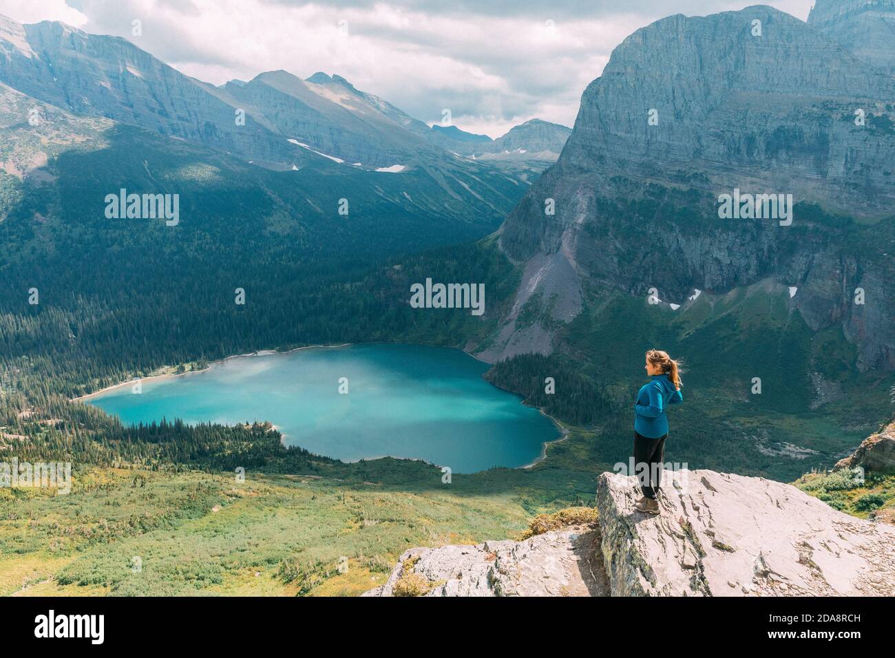Hiker on cliff, Glacier National Park, Montana, USA Stock Photo - Alamy