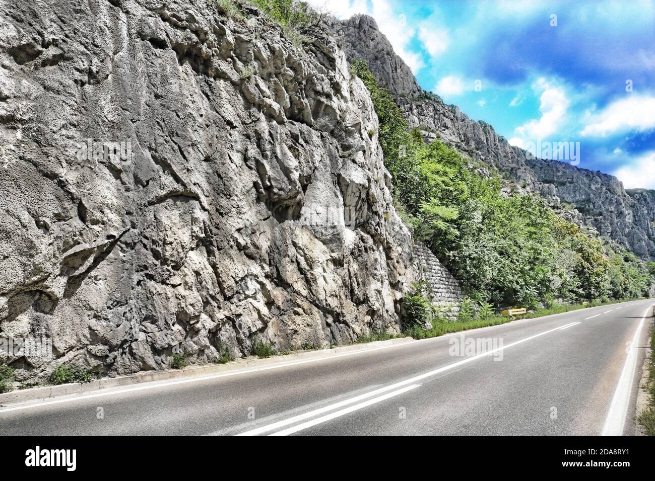 Road,rocks and the clear sky Stock Photo - Alamy