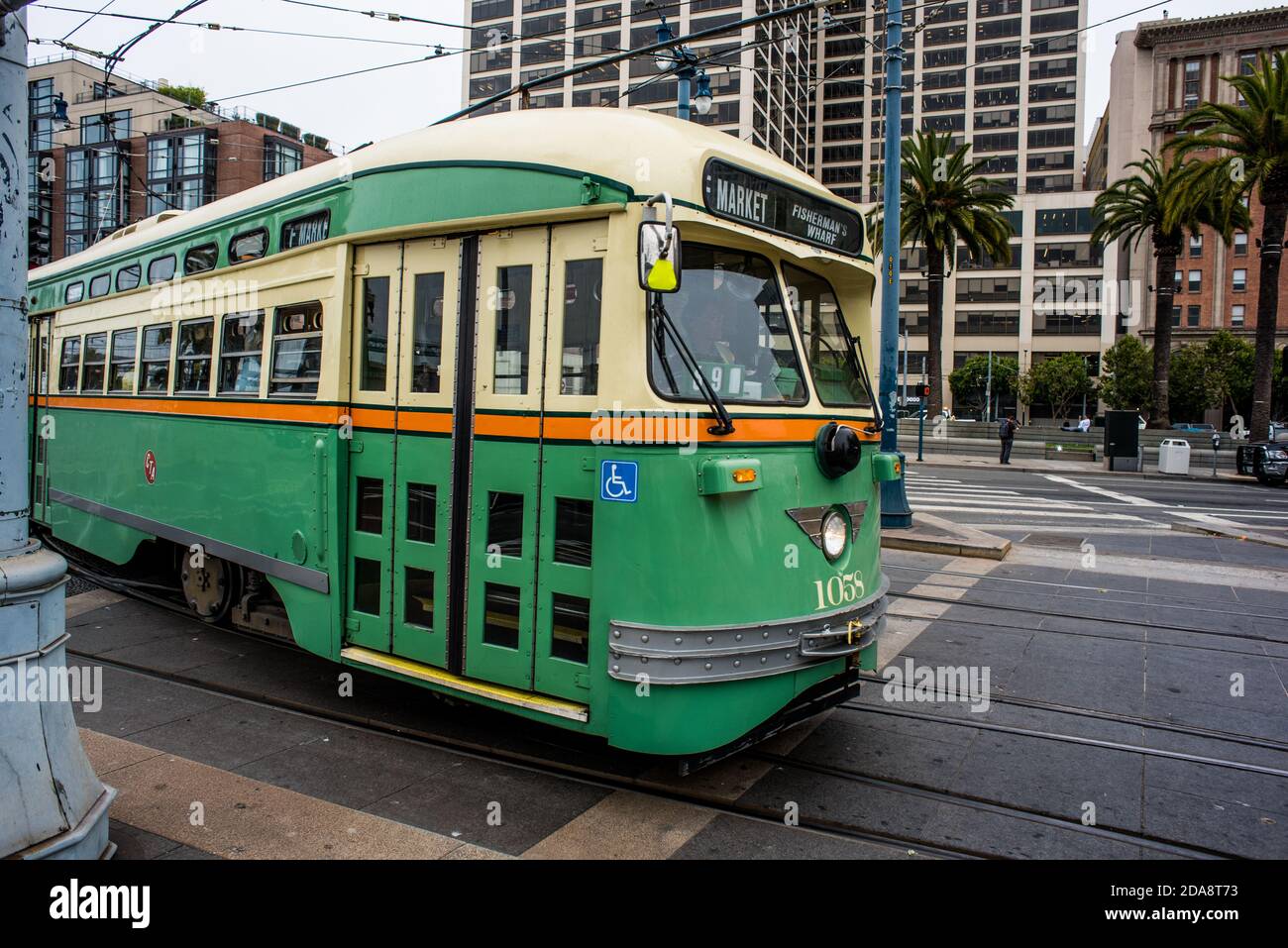 Green streetcar on its rails Stock Photo - Alamy