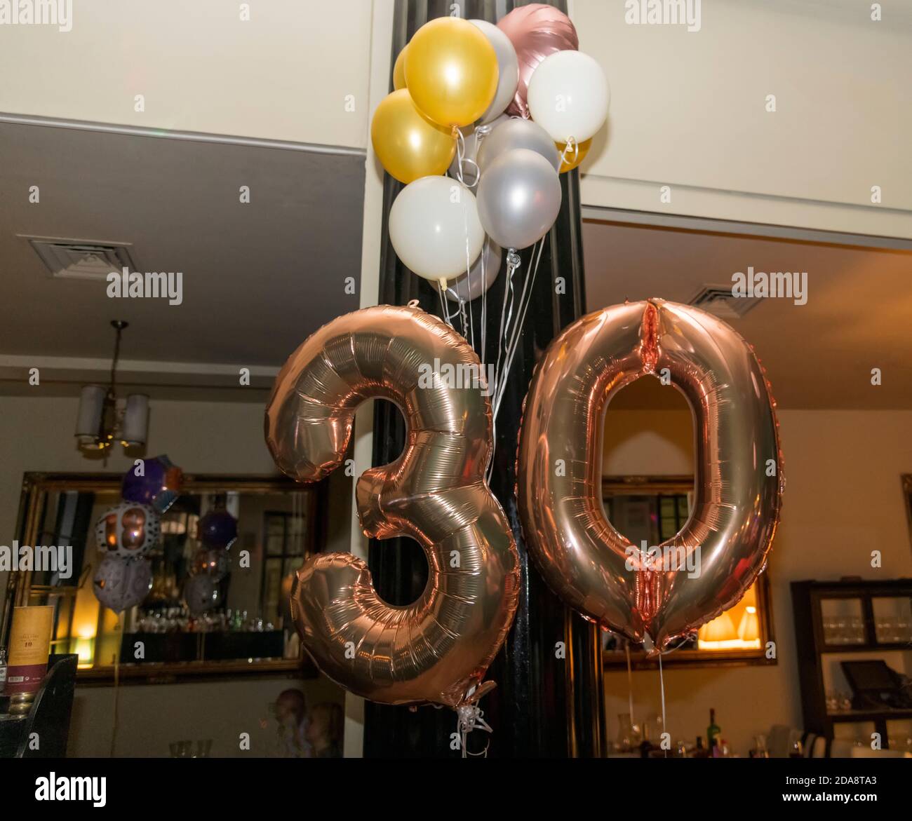 Golden number 30 thirty made of inflatable balloons Stock Photo - Alamy