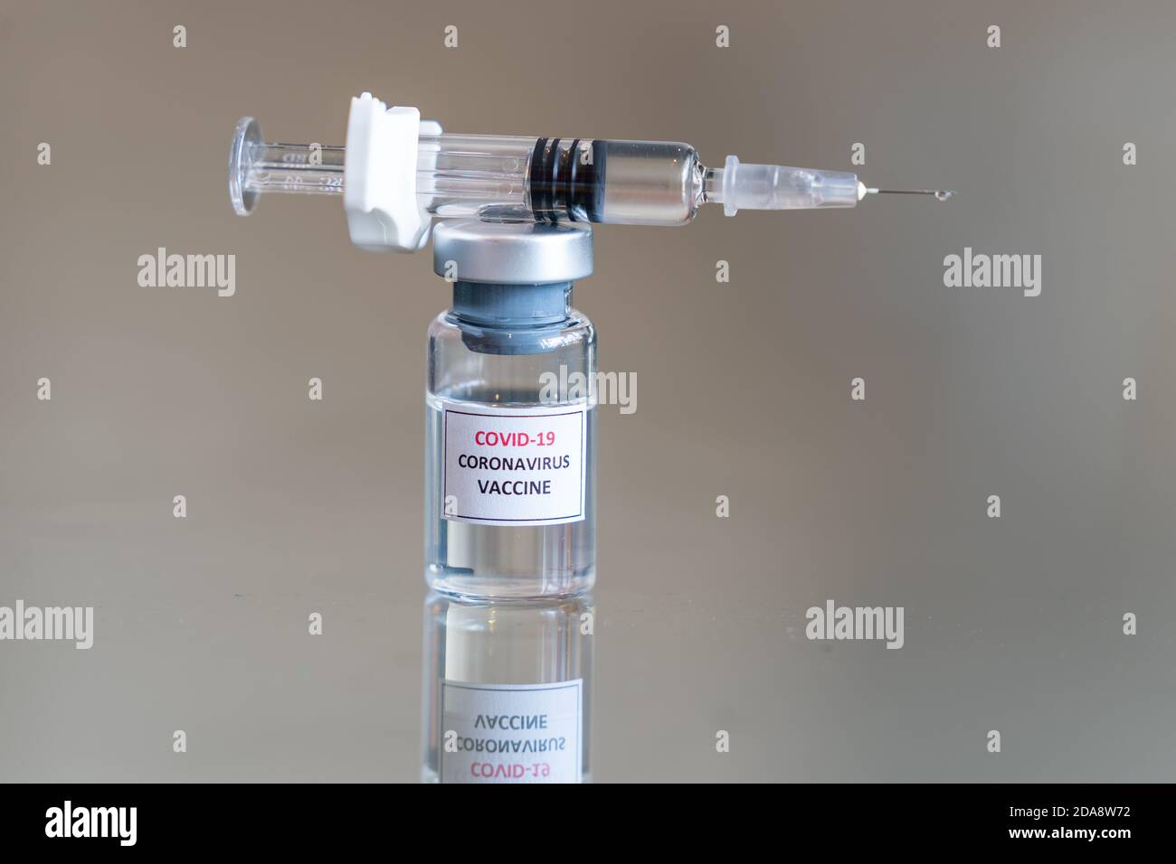 Closeup view of a medical vial labelled as a COVID-19 Coronavirus ...