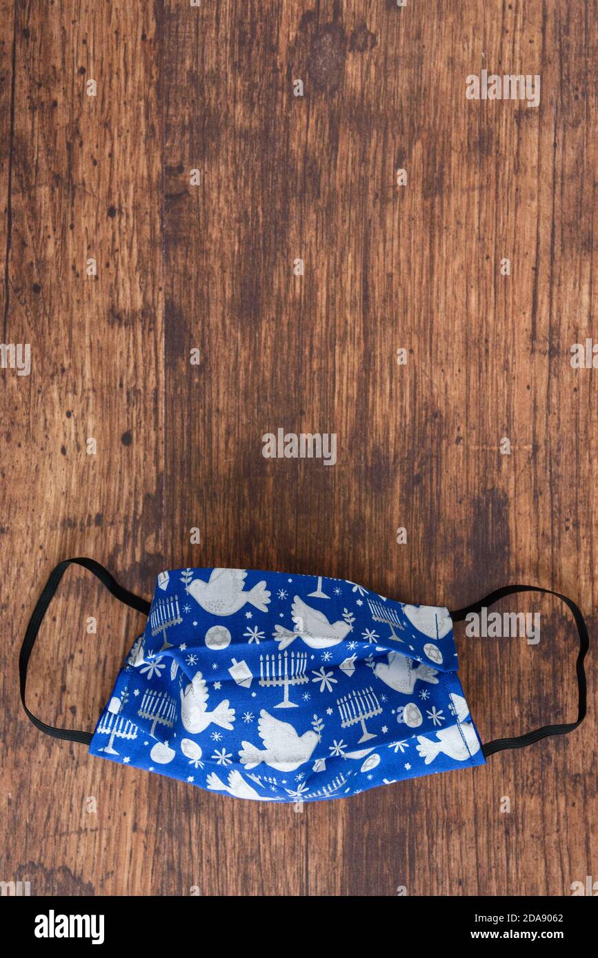 Hand made fabric masks on a wood background, celebrate Hanukkah with ...