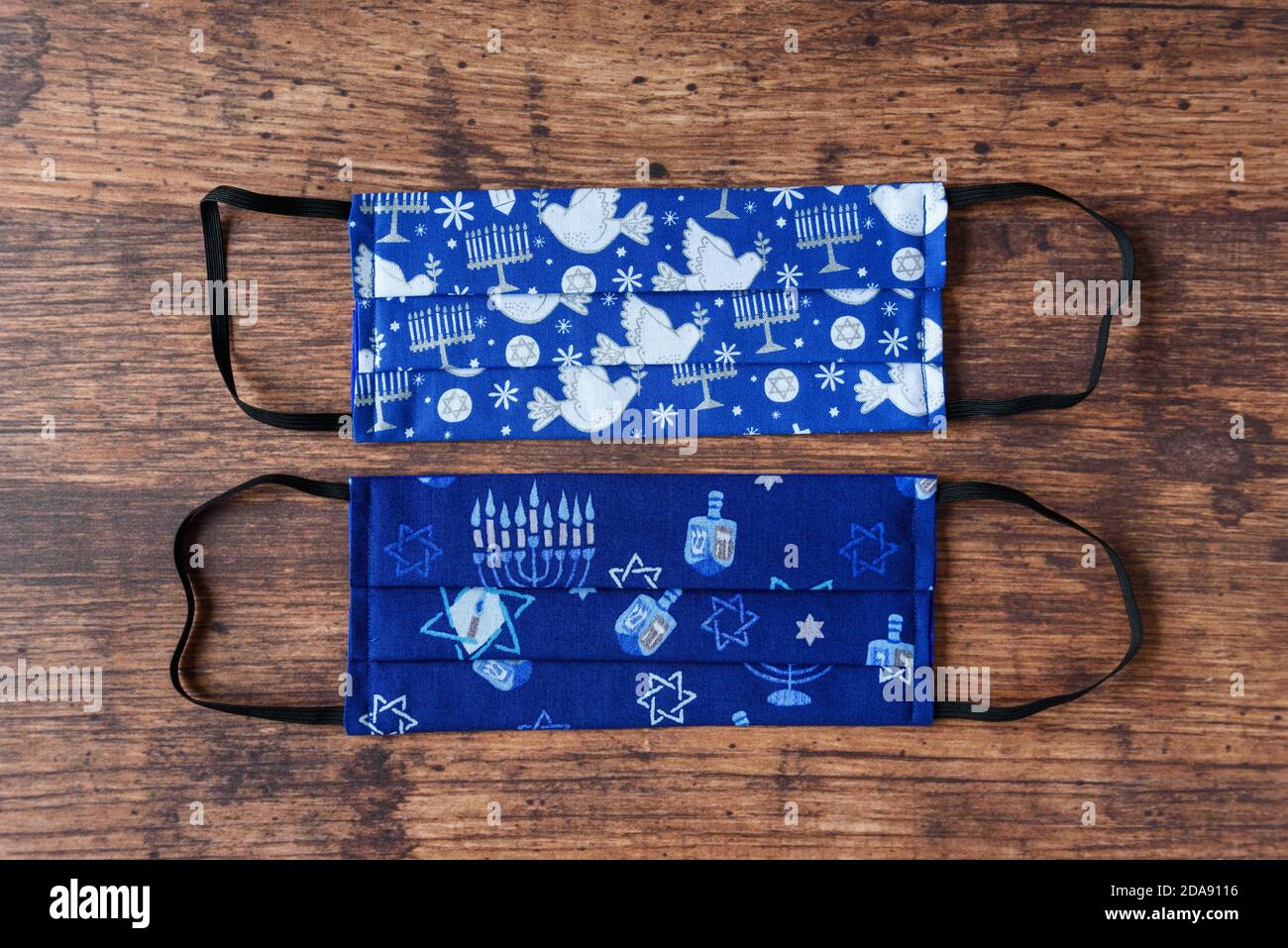 Hand made fabric masks on a wood background, celebrate Hanukkah with ...