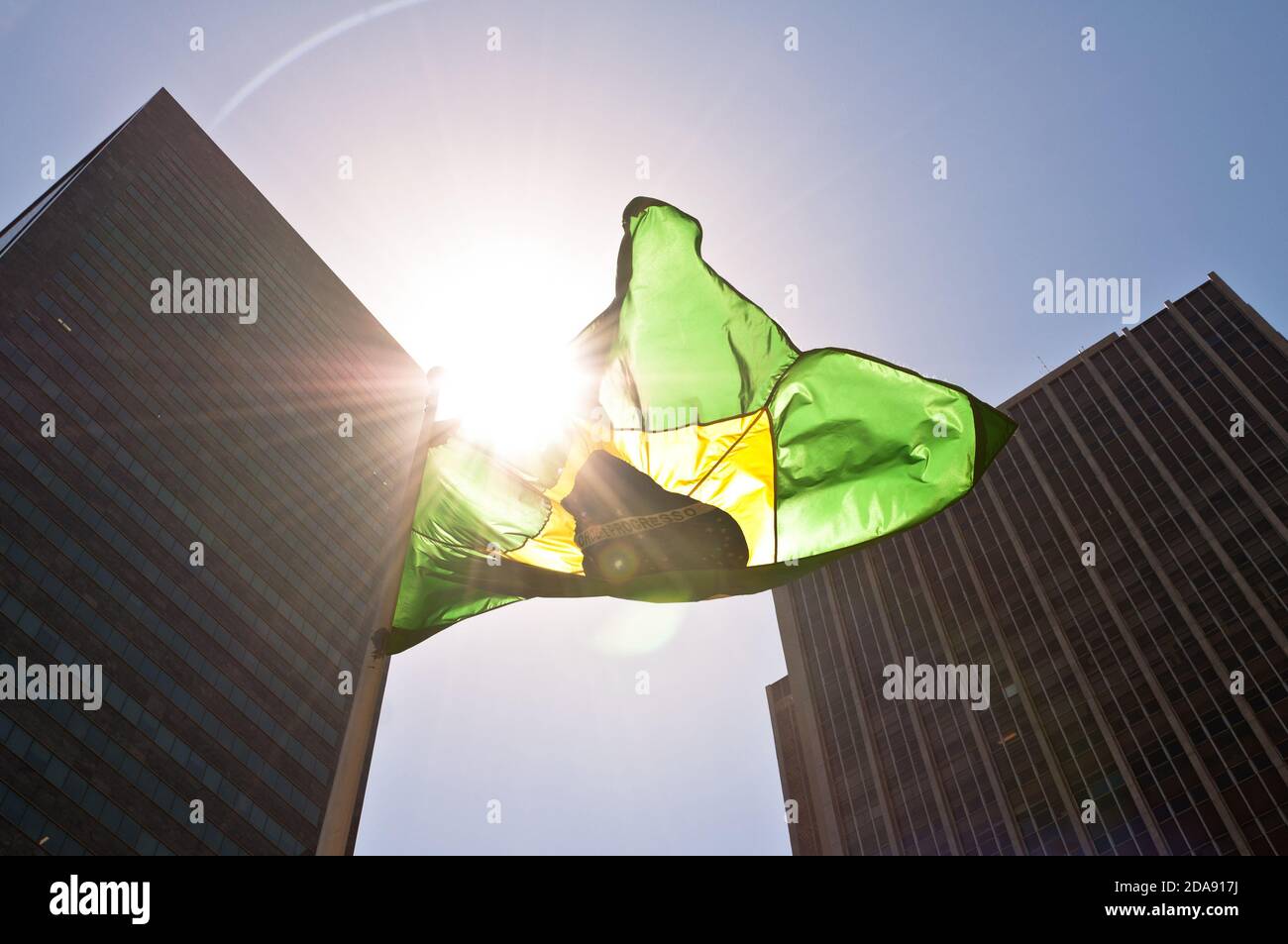 Brazilian National Flag against Skyscrapers by Sunset Stock Photo - Alamy