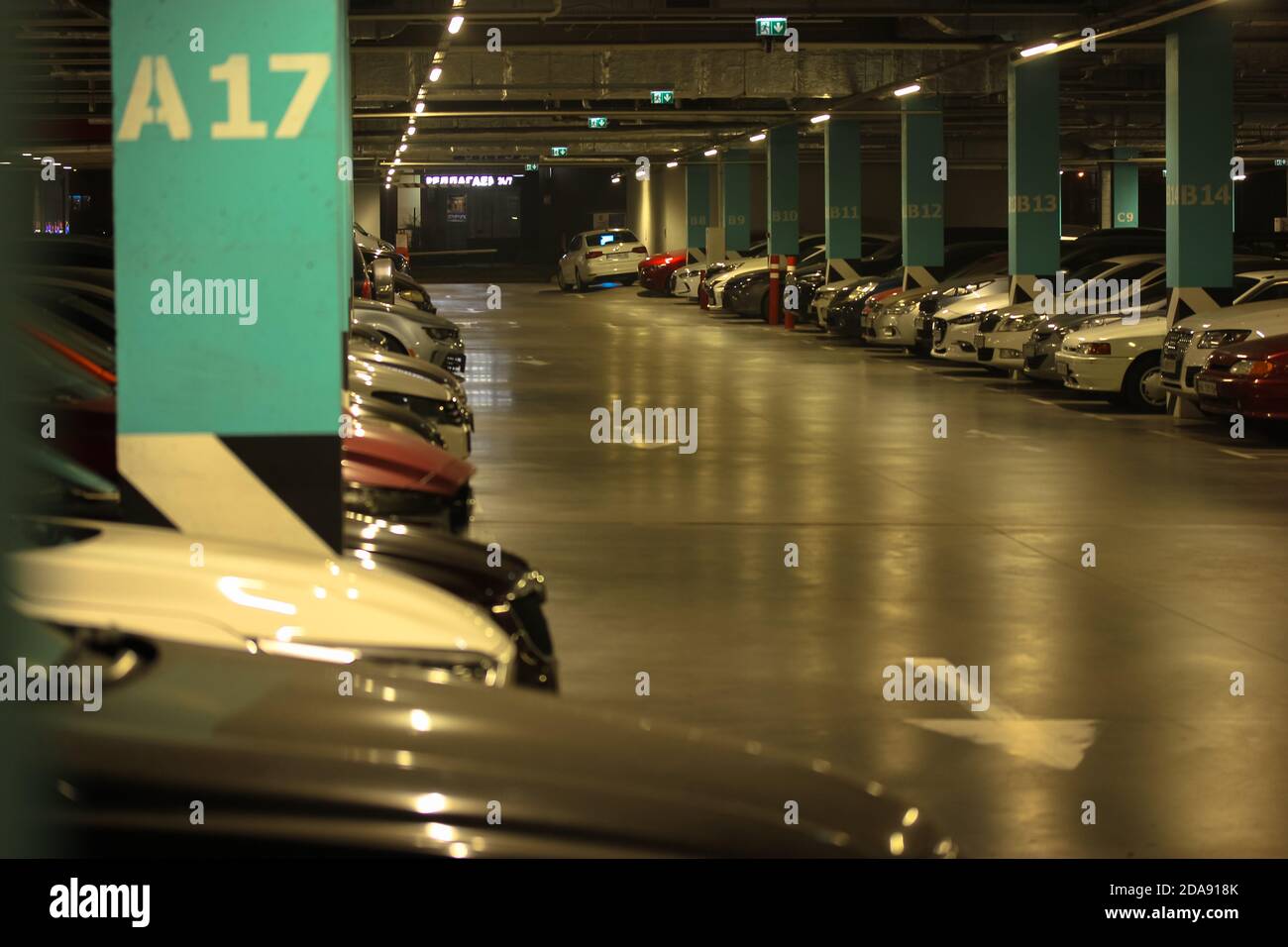 Indoor parking in the mall, many cars of different brands and a free ...