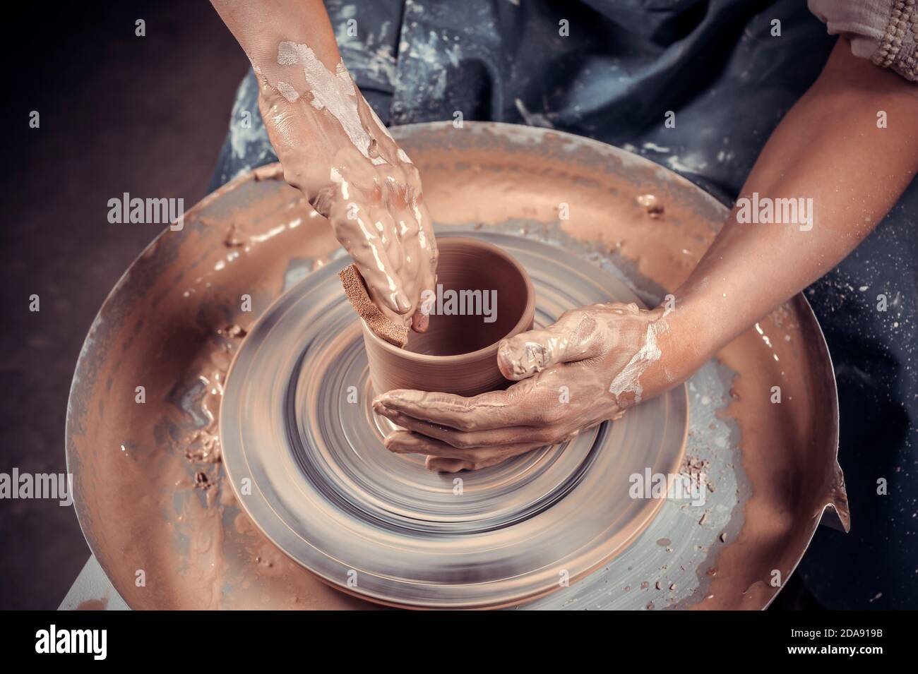 hands of potter do a clay pot Stock Photo - Alamy